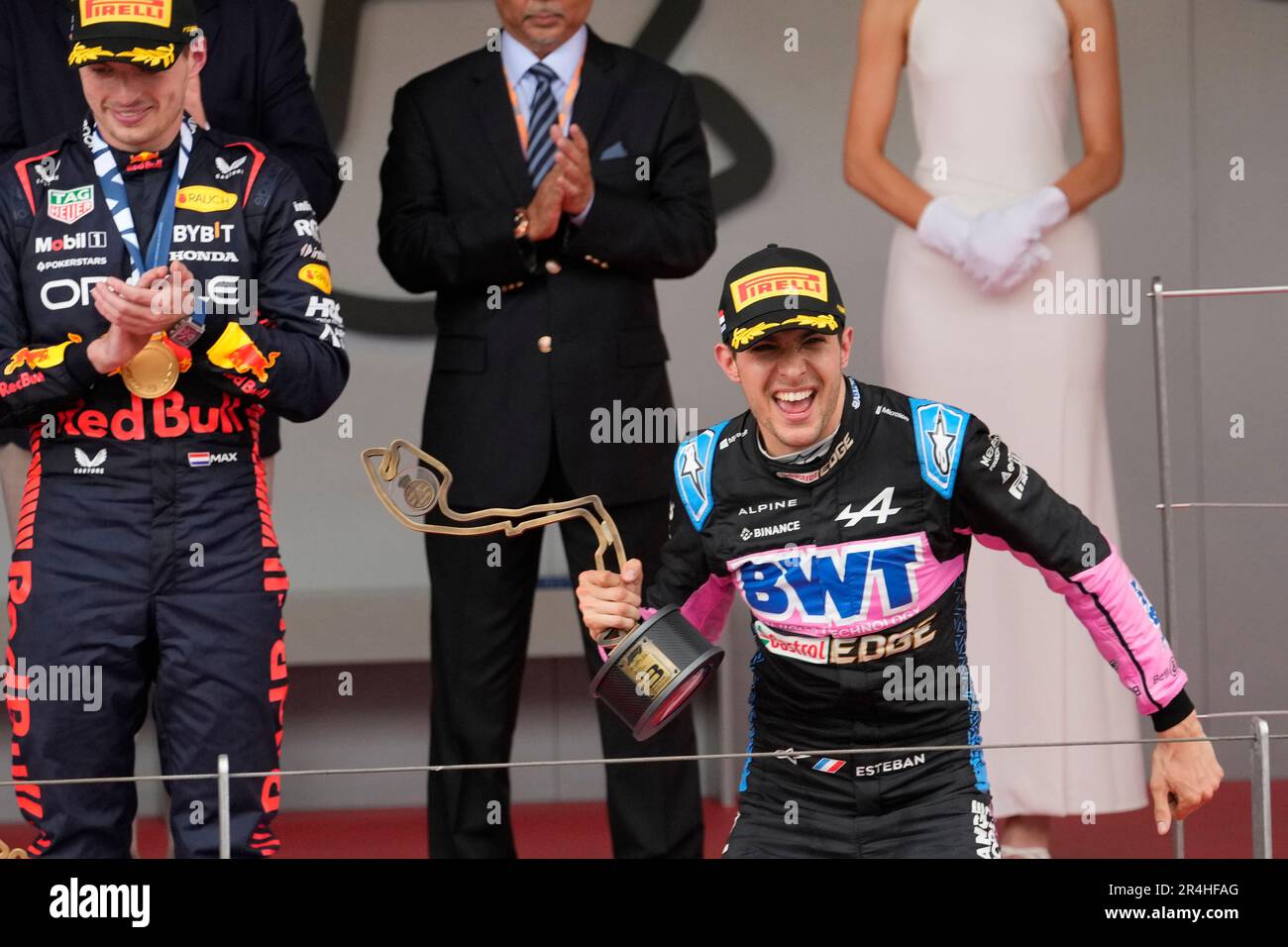 Alpine driver Esteban Ocon of France, right, holds his trophy and ...