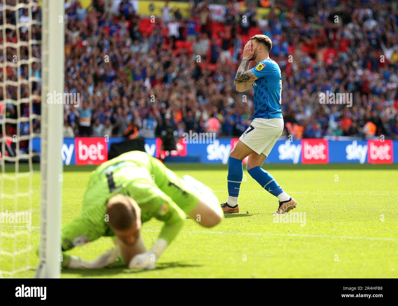 Stockport County's Ryan Rydel (right) reacts to missing his penalty in ...