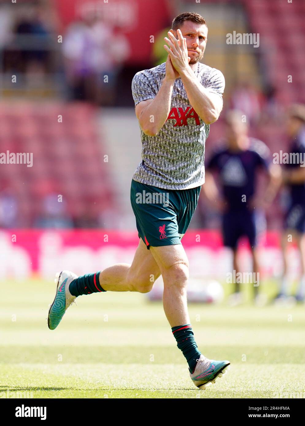 Liverpool's James Milner applauds the fans during a warm up before the ...