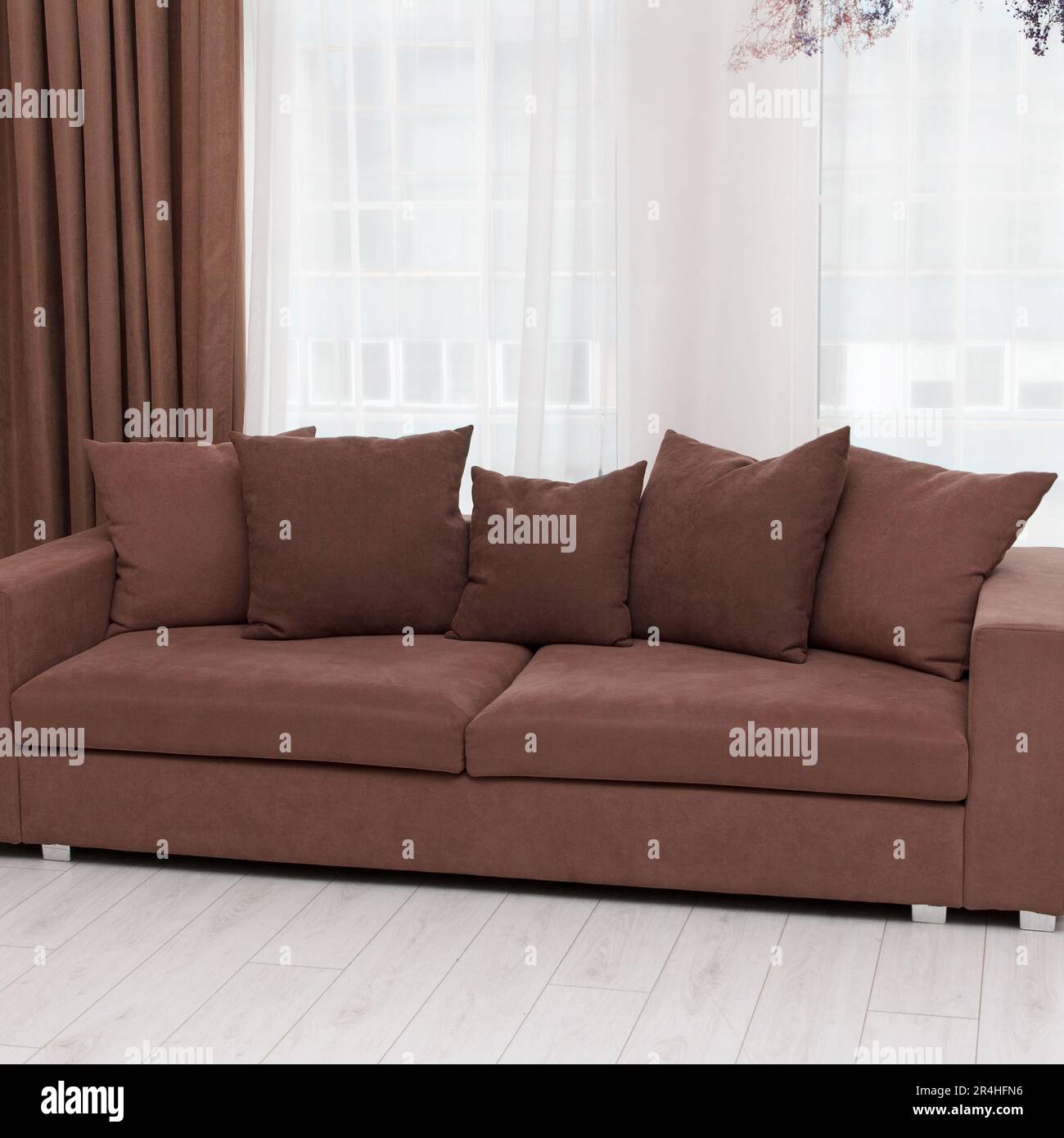 Beautiful brown sofa with five pillows, forms part of modern interior ...