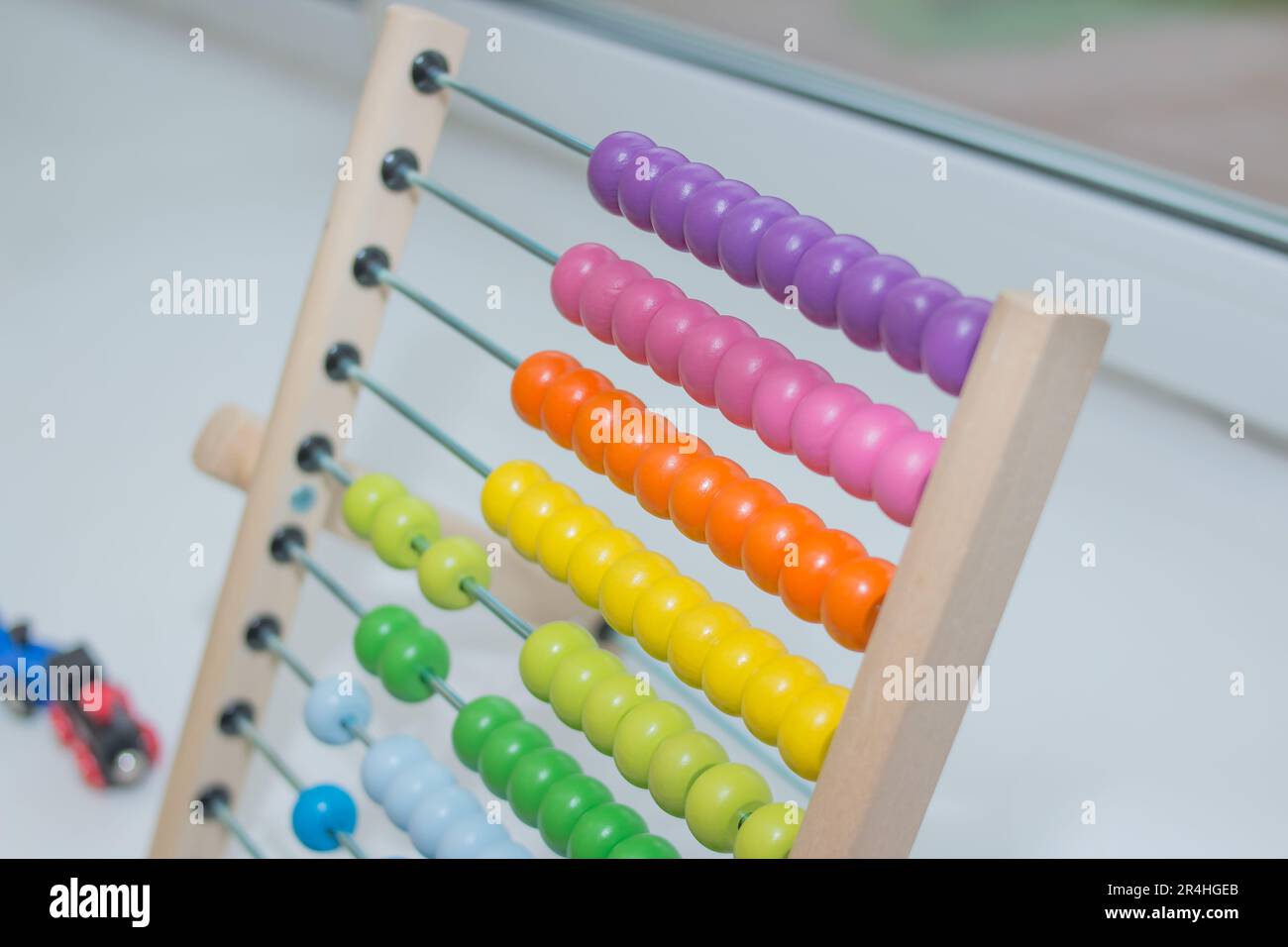 Preschooler baby learns to count. Cute child playing with abacus toy ...