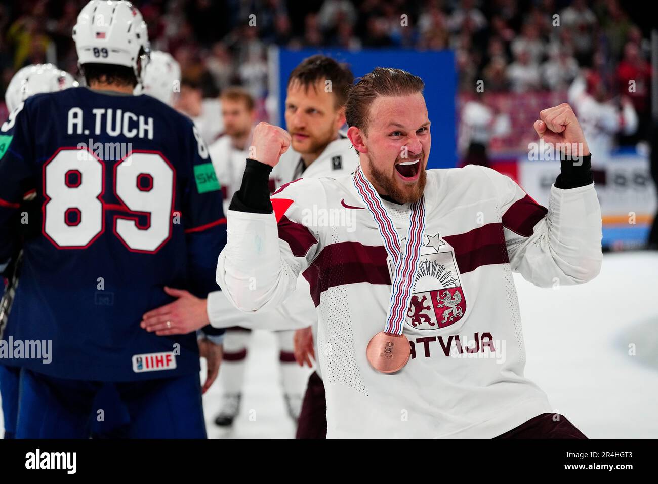 Latvia's Rihards Bukarts (13) celebrates with his bronze medal after ...