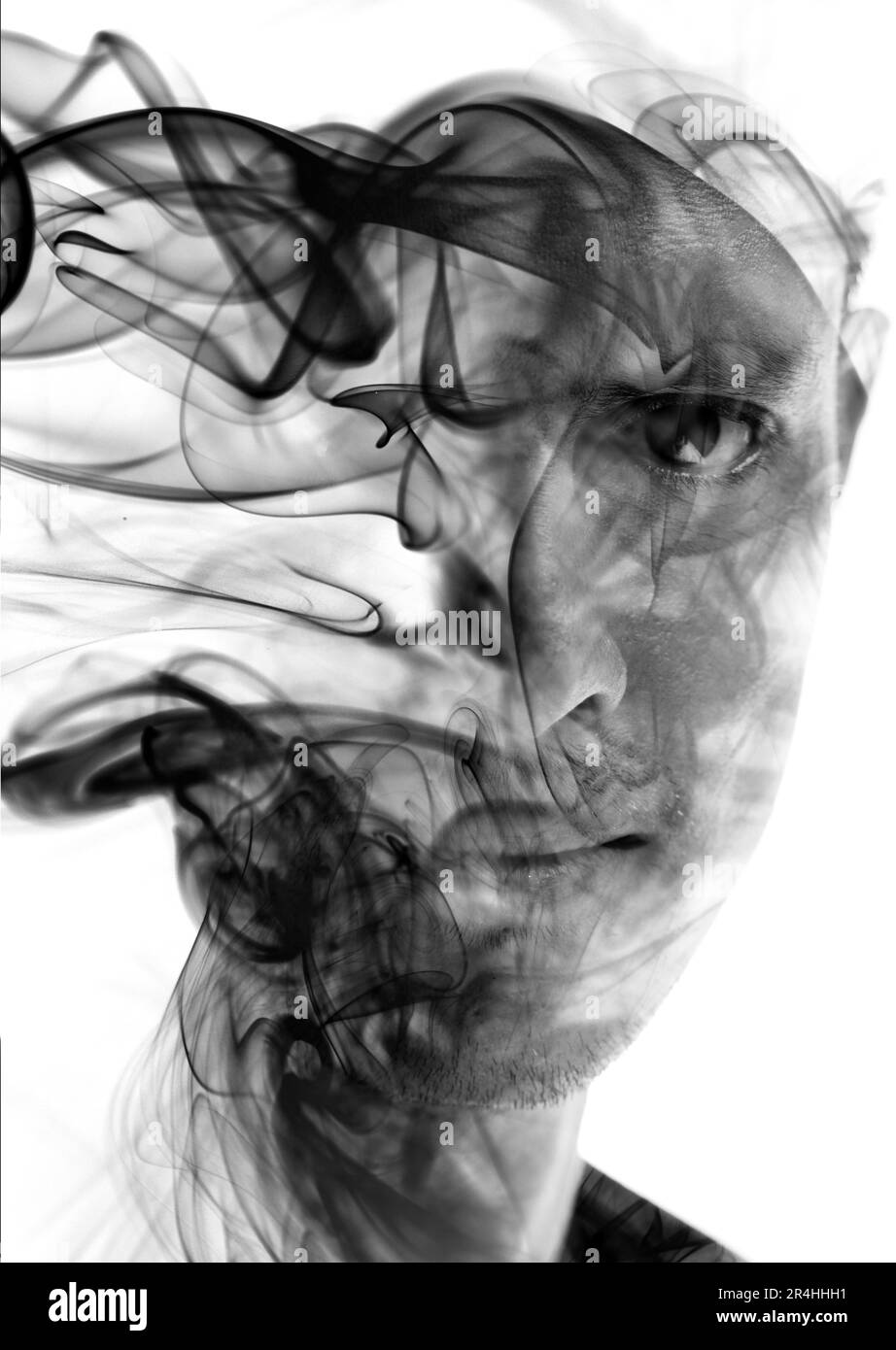 Double exposure black and white portrait of a man's face gazing with ...