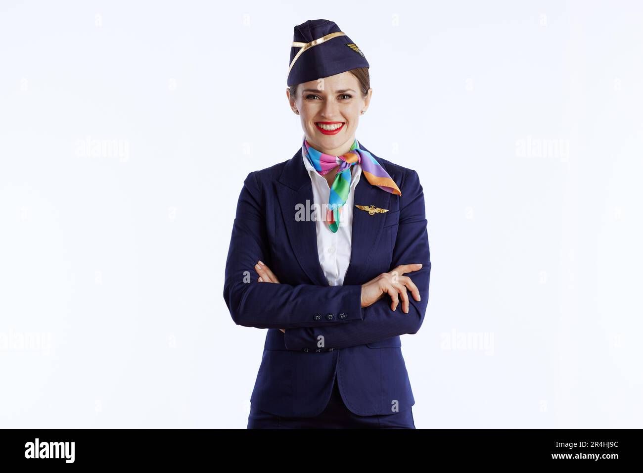 smiling stylish female air hostess isolated on white background in ...