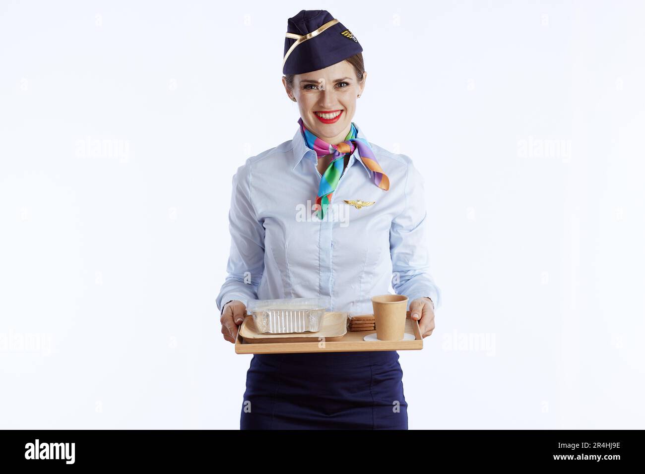 smiling modern female air hostess isolated on white background in ...