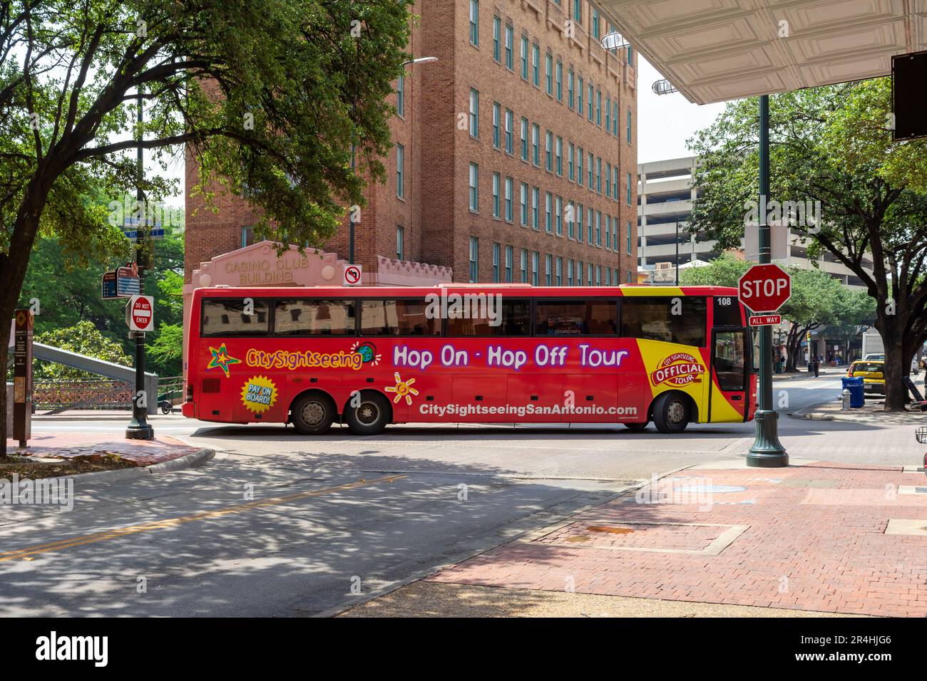 San Antonio, Texas, USA – May 8, 2023: A red Sightseeing bus making a ...