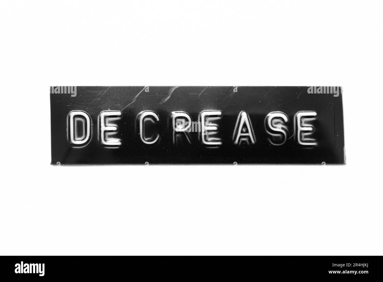 Black color banner that have embossed letter with word decrease on ...