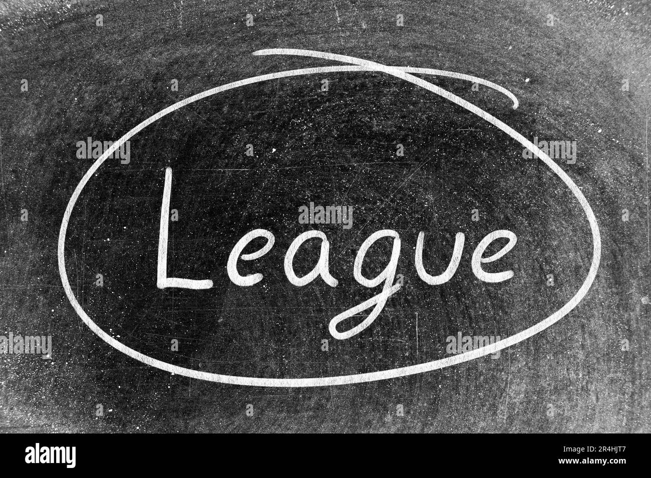 White chalk hand writing in word league and circle shape on blackboard ...
