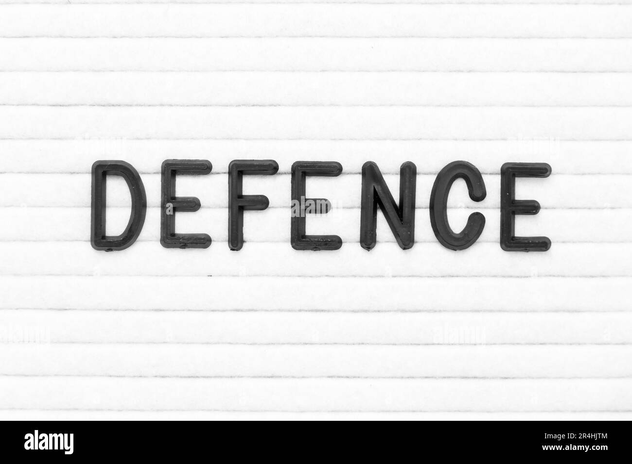 Black color letter in word defence on white felt board background Stock ...