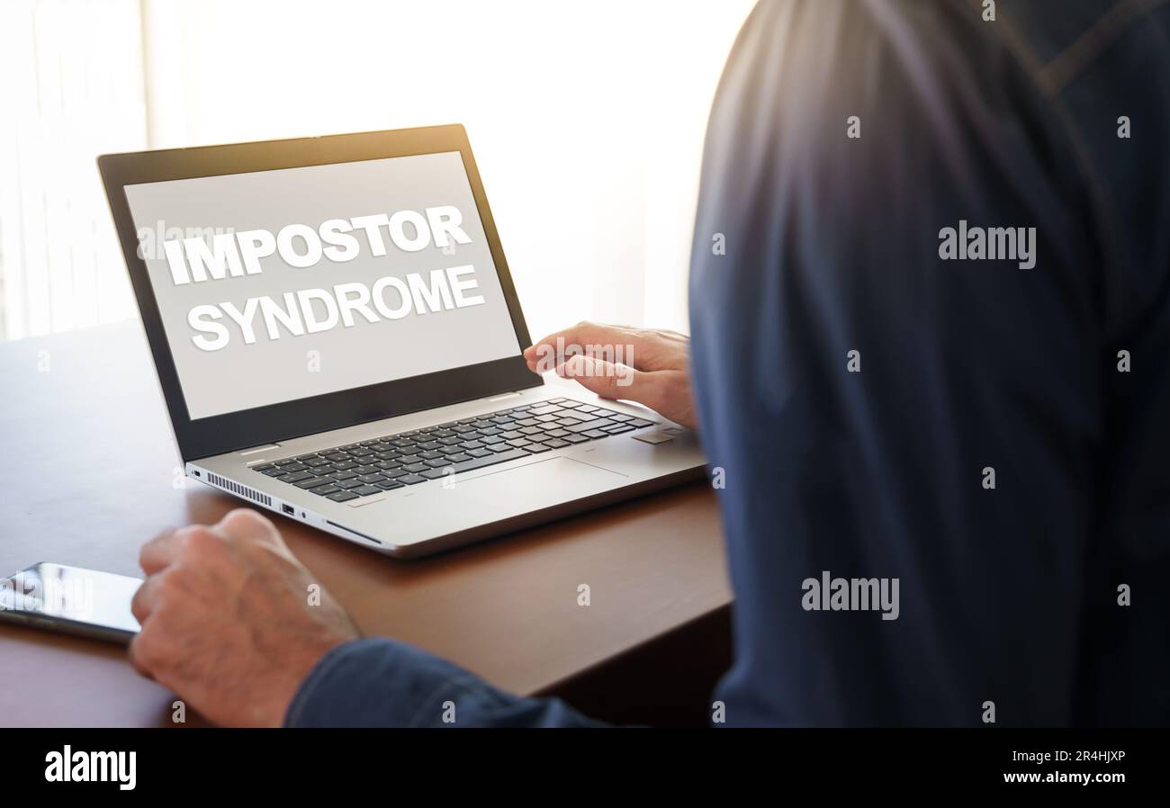 Impostor syndrome text displayed on a modern laptop Stock Photo - Alamy