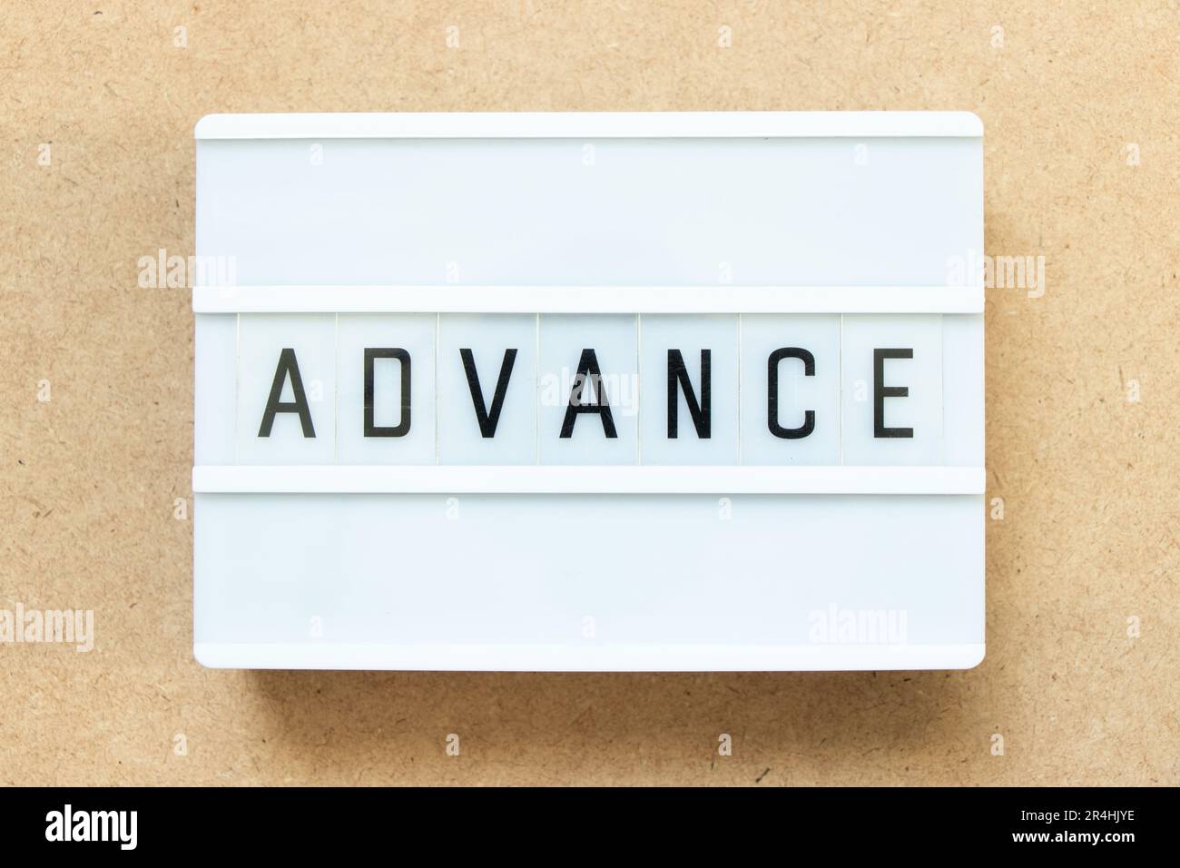 Lightbox with word advance on wood background Stock Photo - Alamy