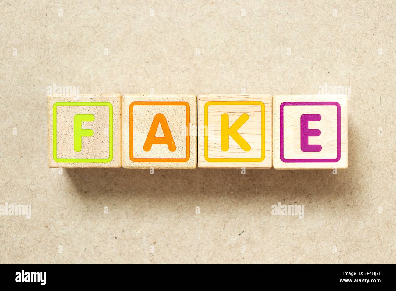 Wooden alphabet letter block in word fake on wood background Stock ...