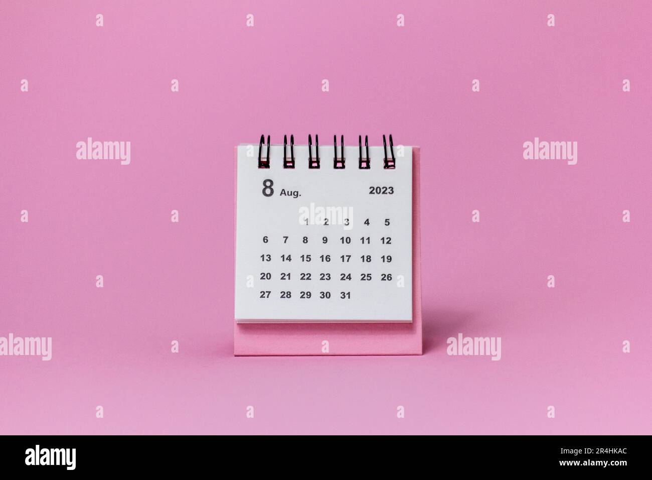 Desktop calendar for August 2023 on a pink background.Calendar for ...