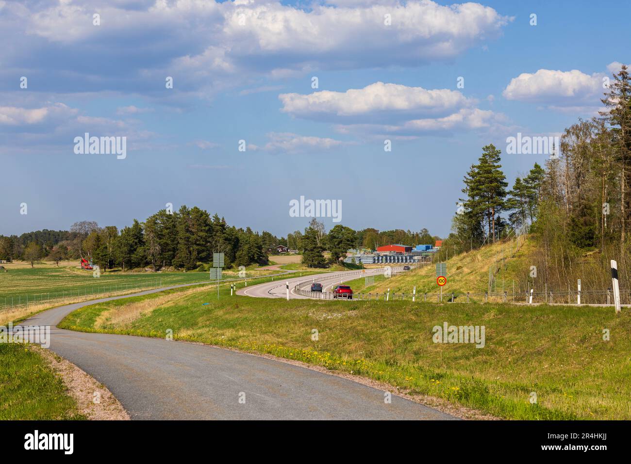 View of highway with cars and an asphalt road for pedestrians and ...