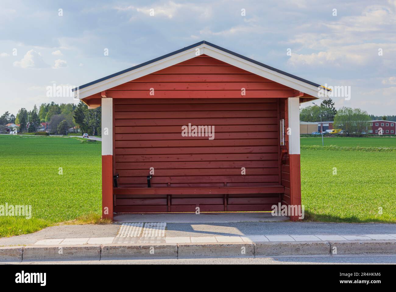 Close up view of Swedish old style traditional red wooden bus stop on ... Close up view of Swedish old style traditional red wooden bus stop on ...
