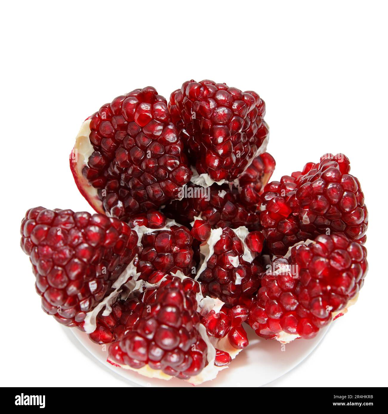 Sweet, ripe peeled red pomegranate. Sections and grains of a large ...