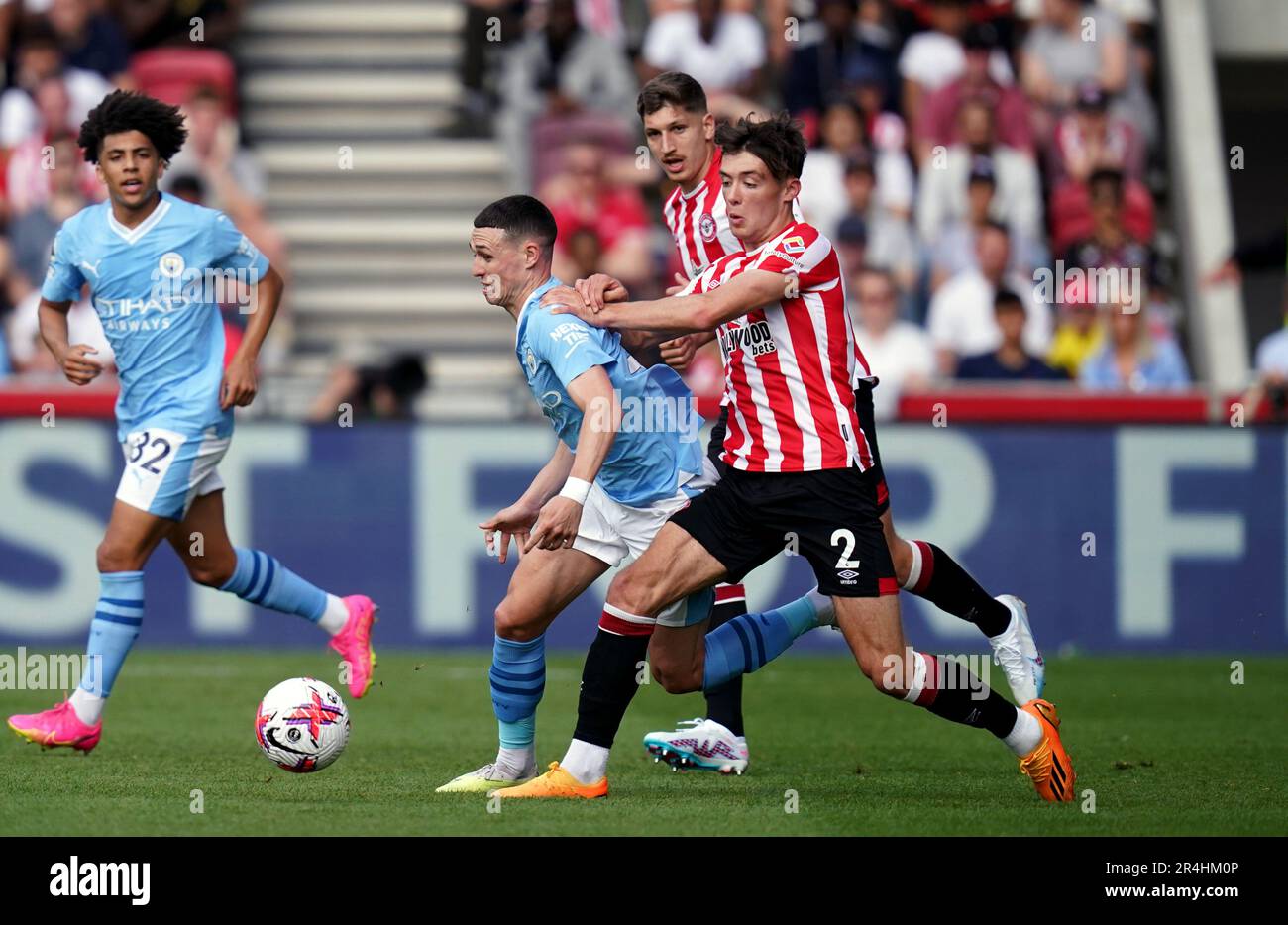 Manchester City's Phil Foden gets away from Brentford's Aaron Hickey ...