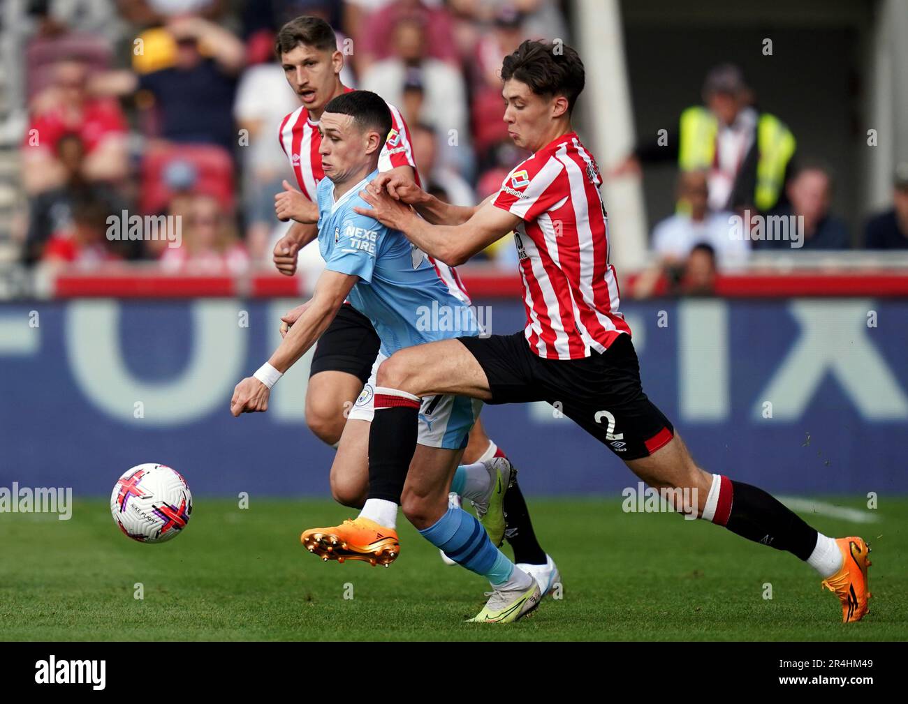 Manchester City's Phil Foden gets away from Brentford's Aaron Hickey ...