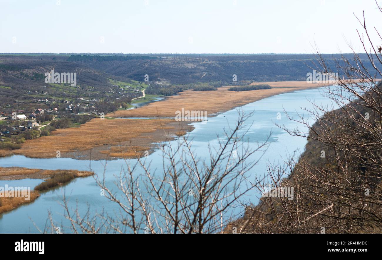 River flowing between hills and village in rural areas. Landscape Stock ...