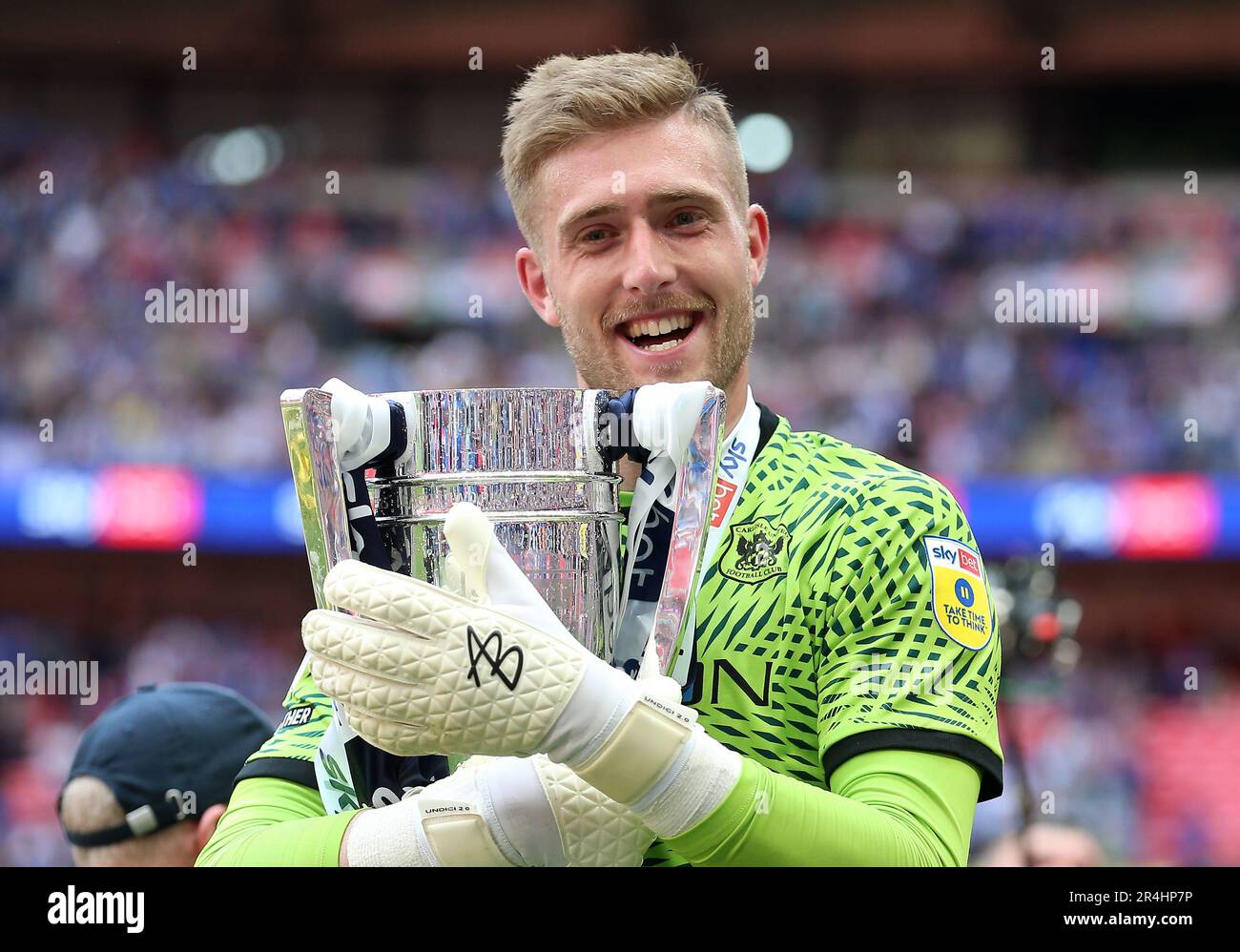 Carlisle United goalkeeper Tomas Holy with the trophy after being ...