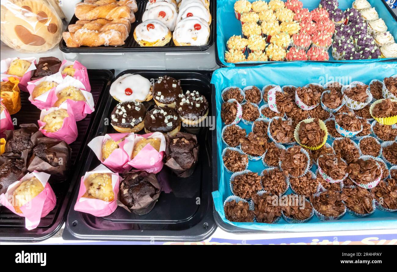 Trays of cakes on display at a kid's paty Stock Photo - Alamy