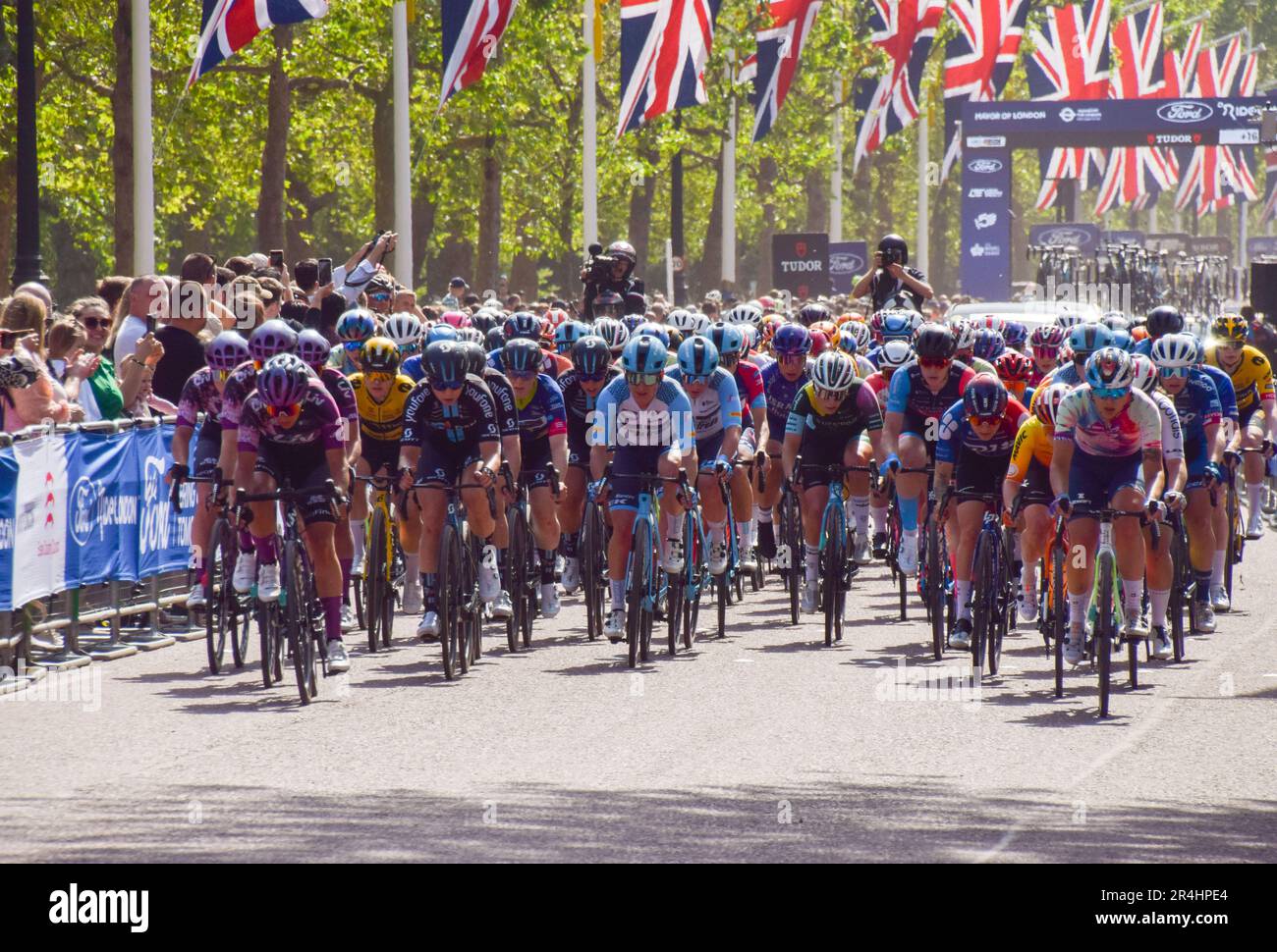 London, England, UK. 28th May, 2023. Cyclists pass through The Mall ...