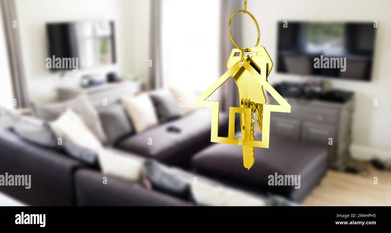 Golden hanging house key against interior of a modern living room Stock ...