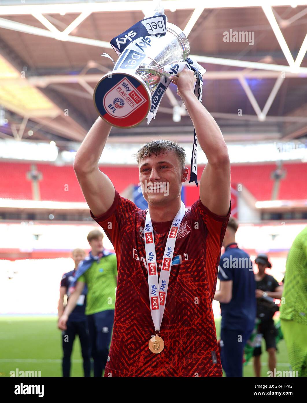 Carlisle United's Owen Moxon celebrates with the trophy after being ...