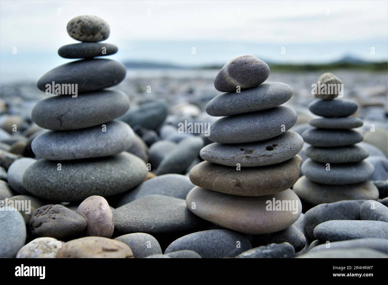 Three Zen towers on a stony beach. Towers made of pebbles Stock Photo ...