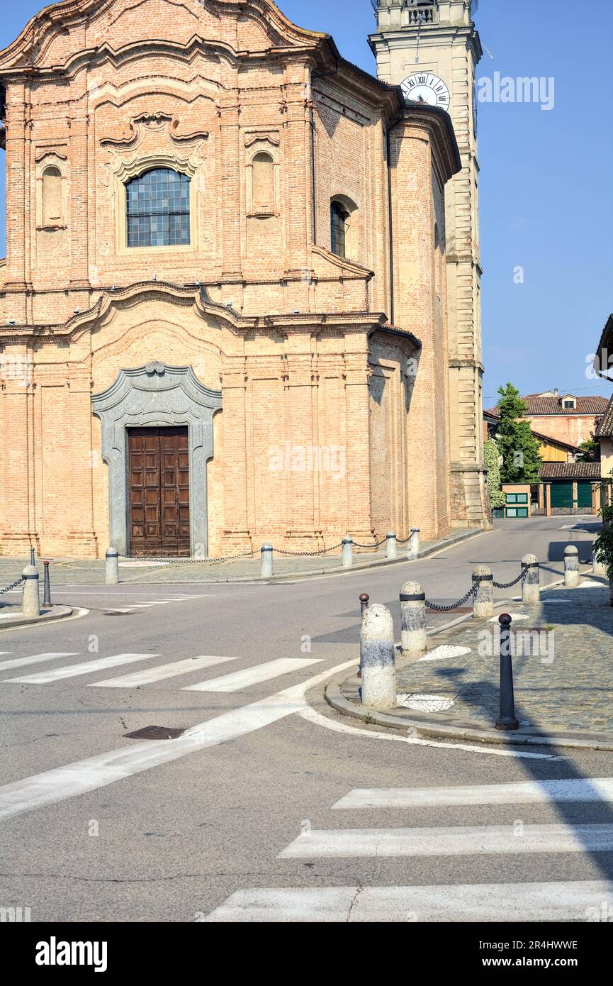 Square in front of a church and a warehouse on a sunny day in a village ...