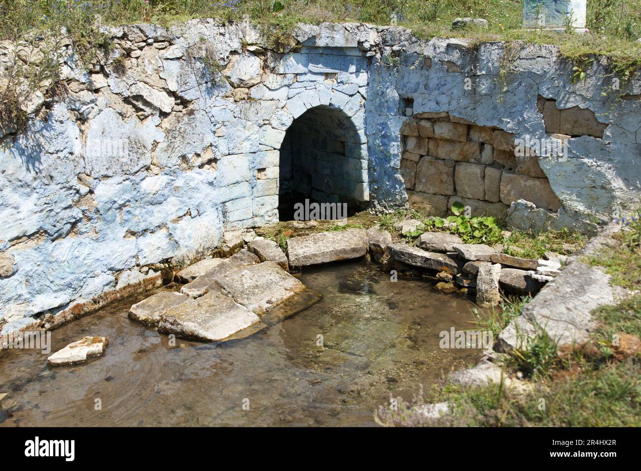 Old spring with transparent clear water in summer outdoors Stock Photo ...