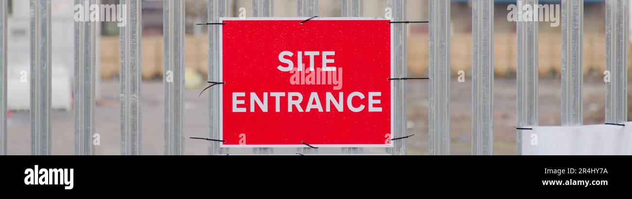 Site entrance sign on fence boundary at construction site Stock Photo ...