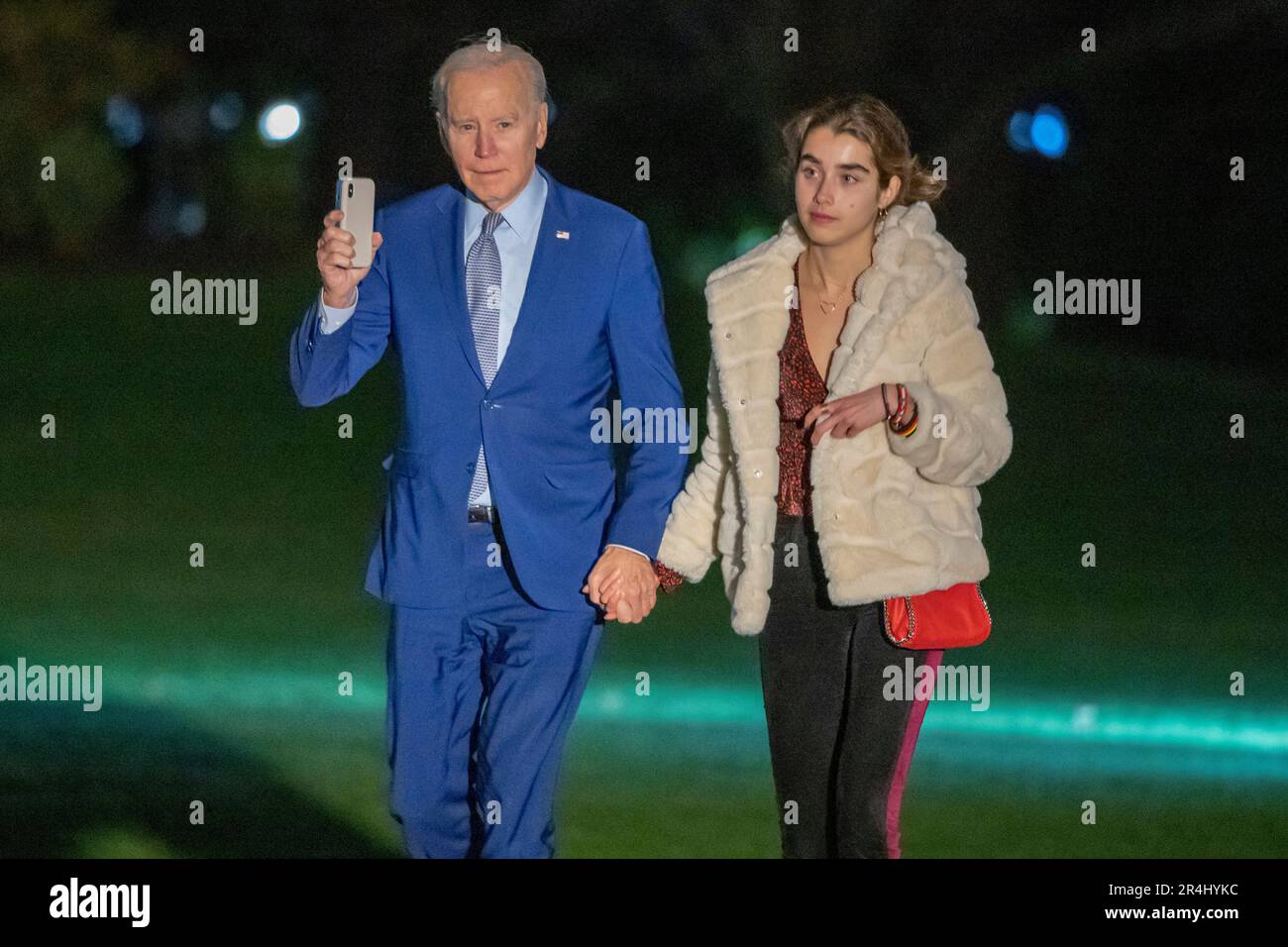 FILE - President Joe Biden waves as he walks from Marine One, with ...