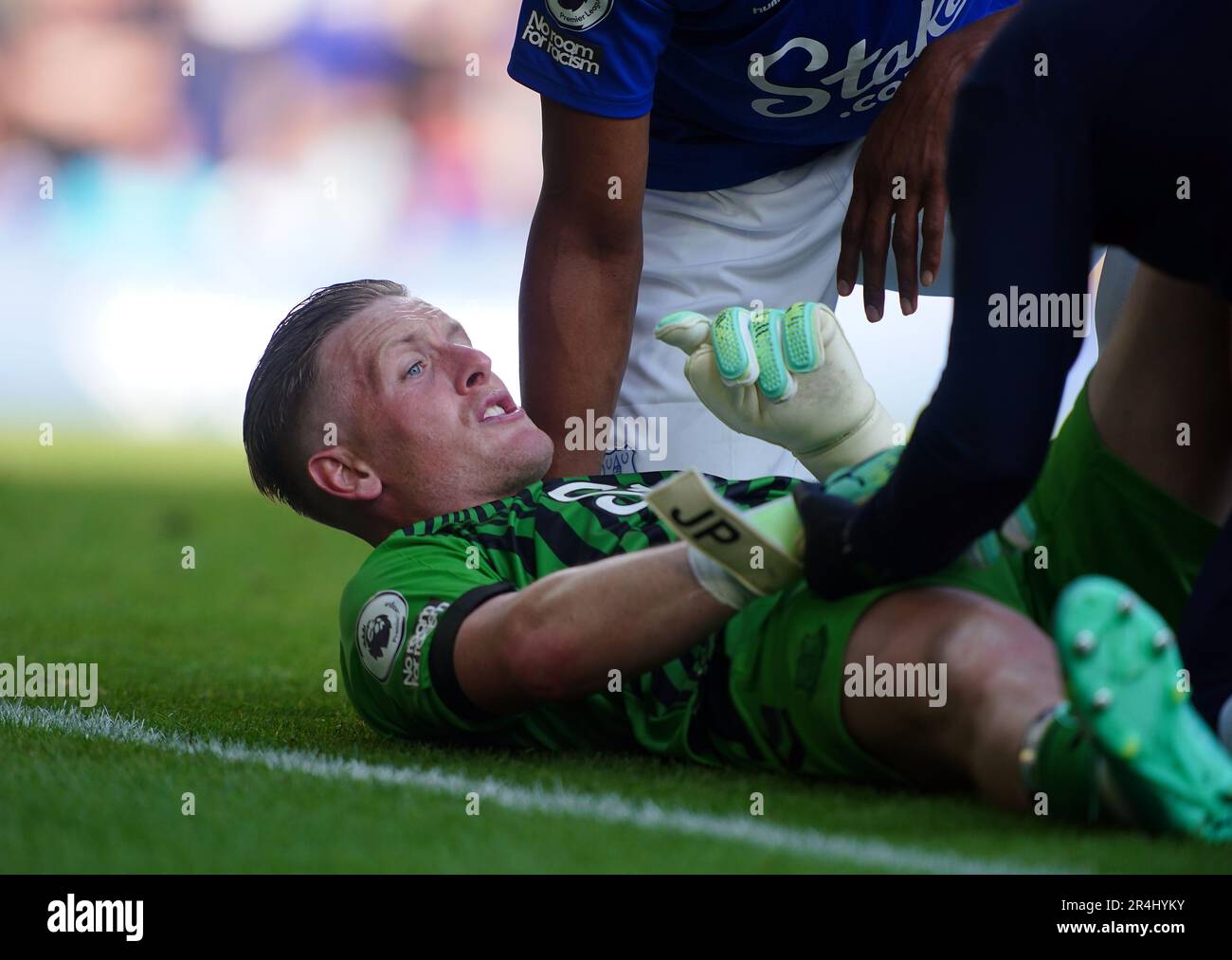 Everton goalkeeper Jordan Pickford receives treatment after getting ...