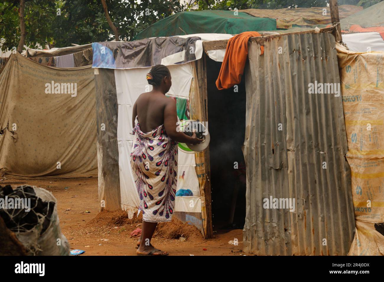 People are seen receiving free medical care at a makeshift shelter at ...