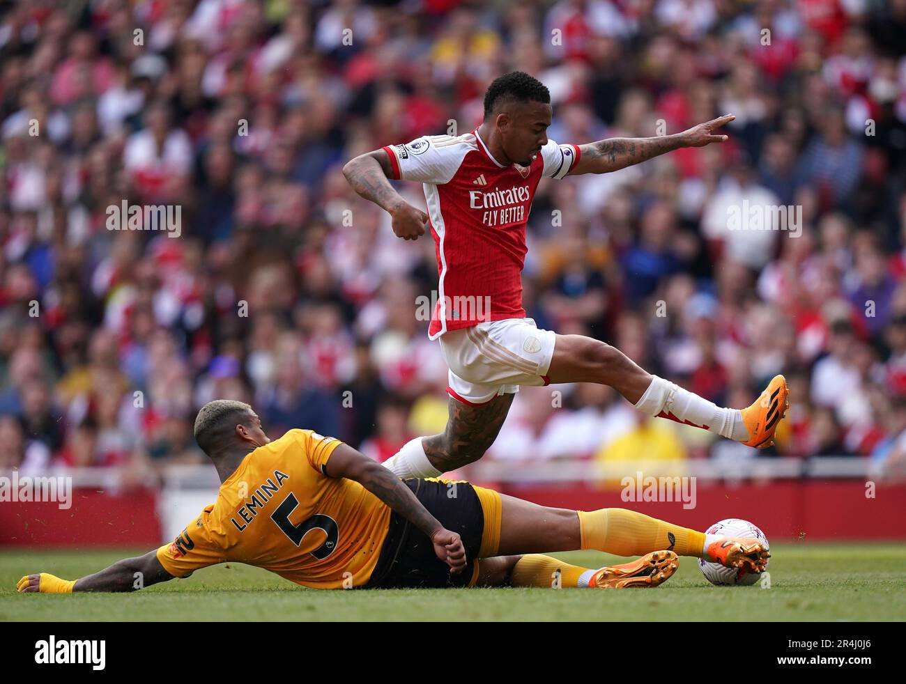 Wolverhampton Wanderers' Joao Gomes (left) challenges Arsenal's Gabriel Jesus during the Premier ...