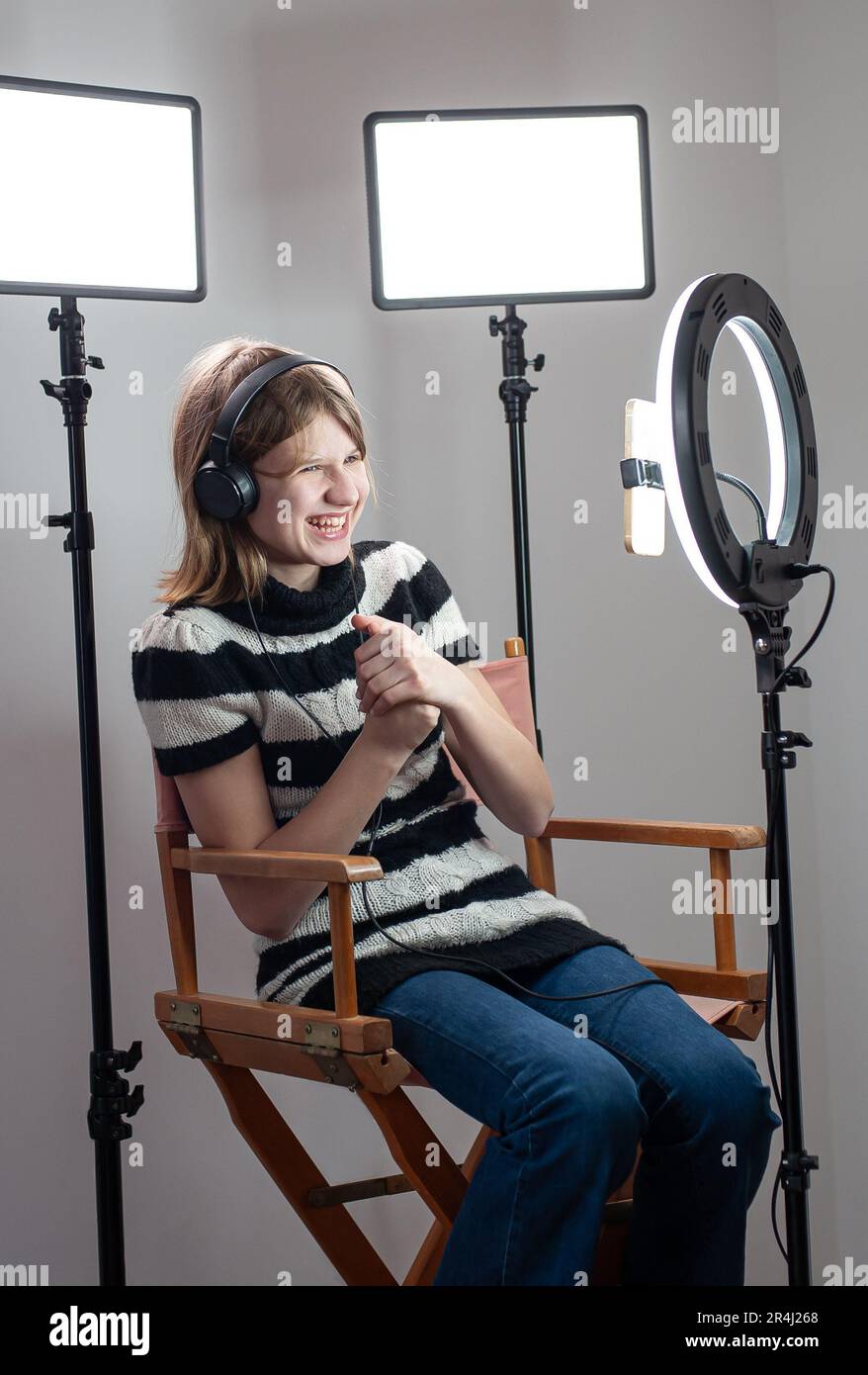 Hi, followers. Happy caucasian girl saying hello to her viewers during ...
