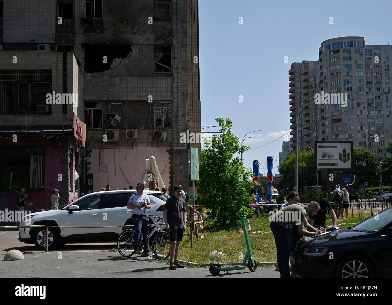 Kyiv, Ukraine. 28th May, 2023. People on the street near the damaged ...