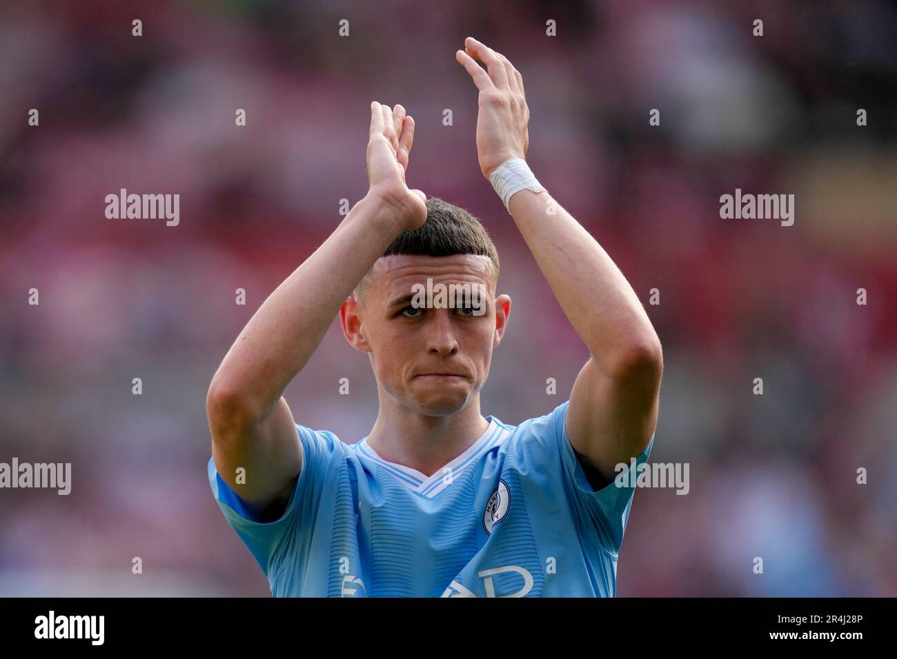 Manchester City's Phil Foden greets fans at the end of the English ...