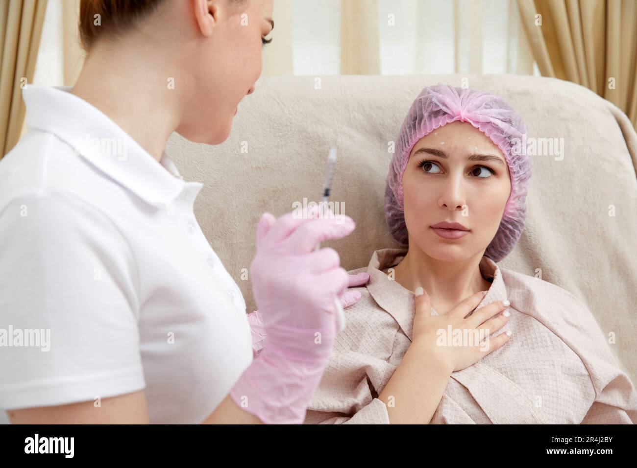 Cosmetologist performs the lift procedure by injecting beauty ...