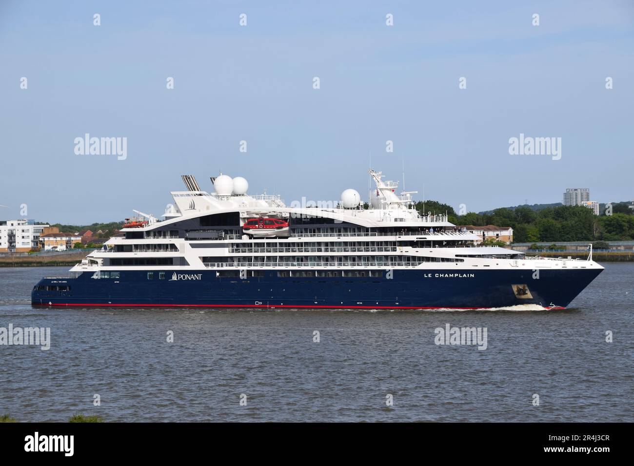 Ponant Cruises ship Le Champlain heading up the River Thames on a visit ...