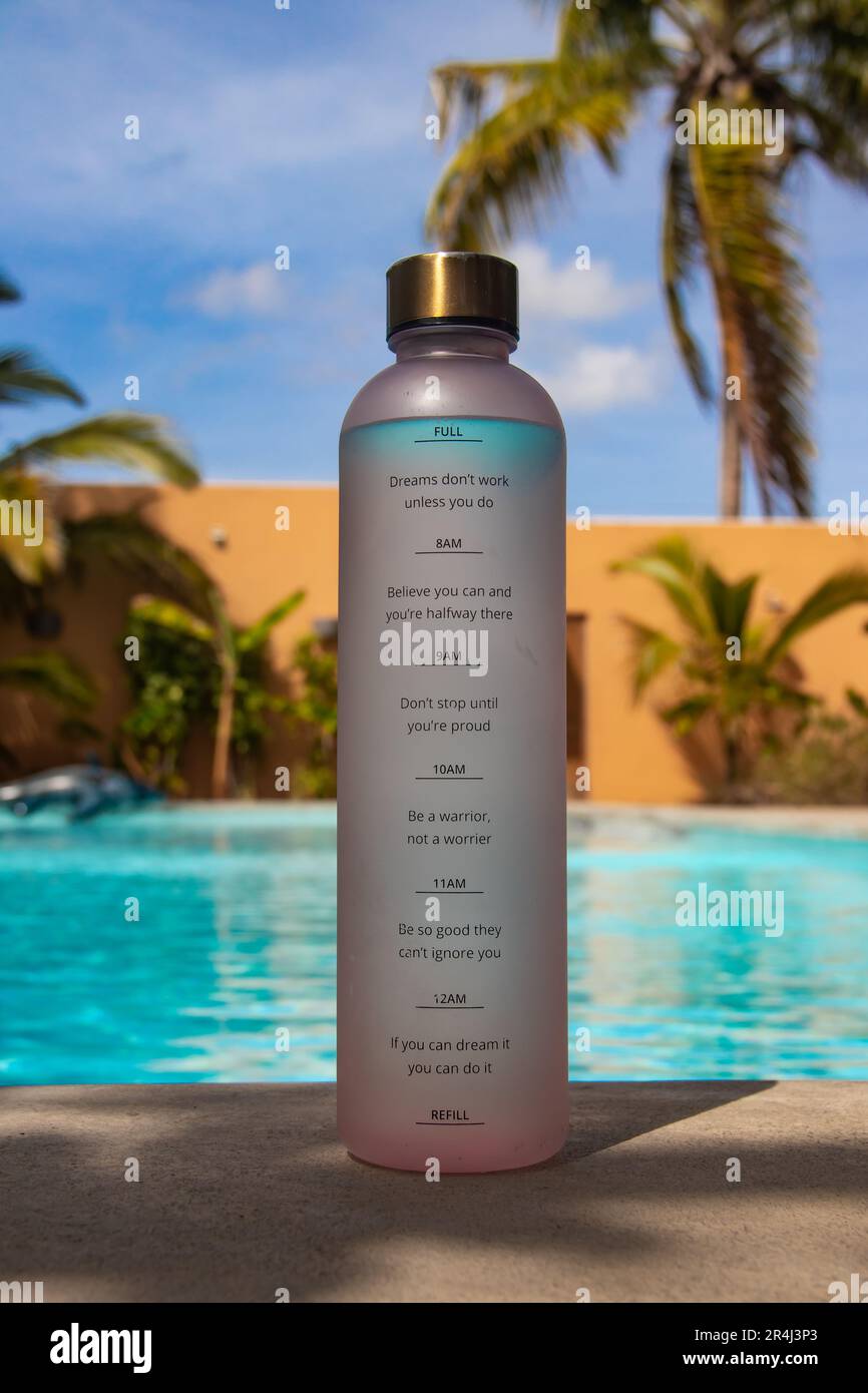 Graphic water bottle next to swimming pool, promoting healthy life by ...