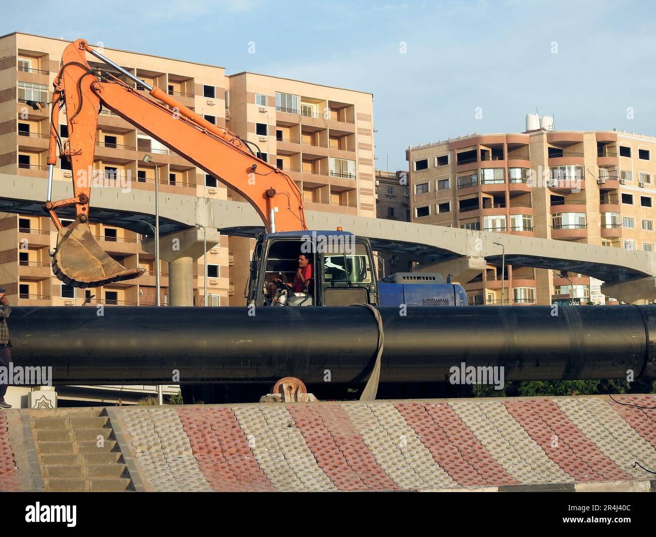 Cairo, Egypt, May 18 2023: preparations to place large water pipe parts ...