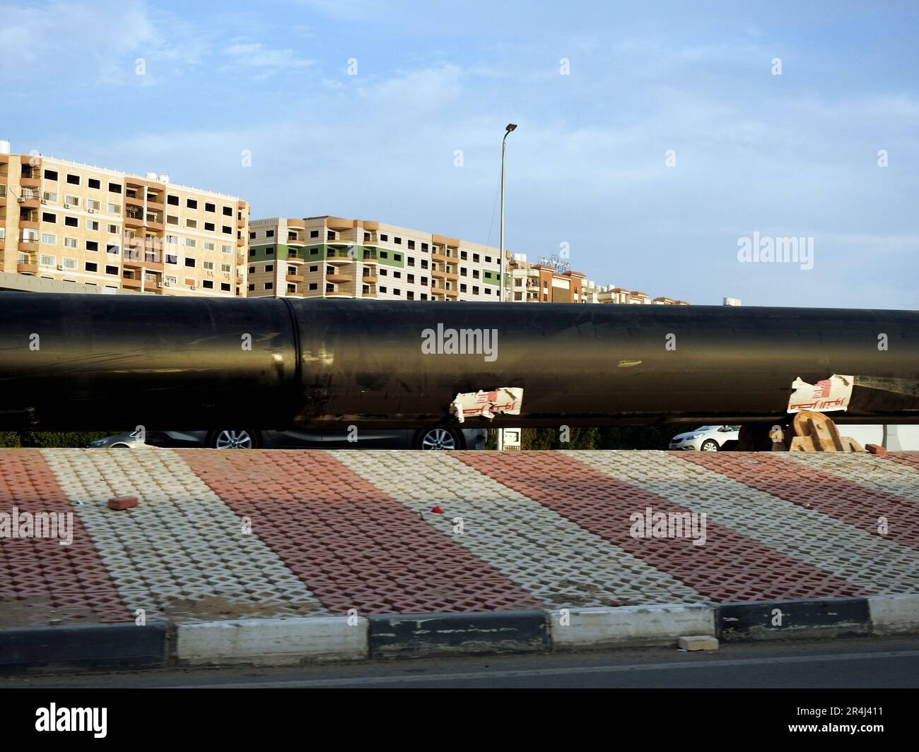 Cairo, Egypt, May 18 2023: preparations to place large water pipe parts ...