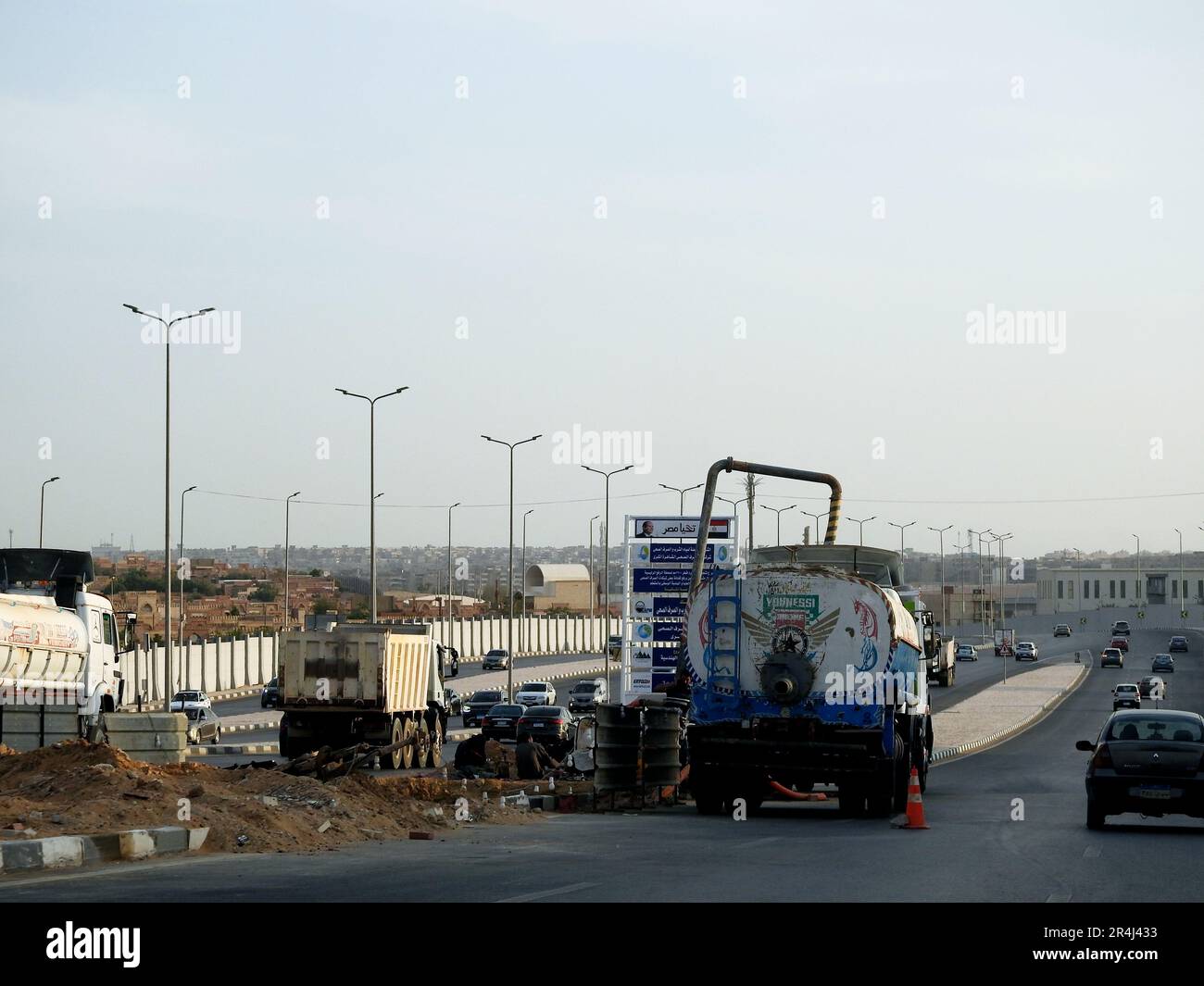 Cairo, Egypt, May 18 2023: preparations to place large water pipe parts ...