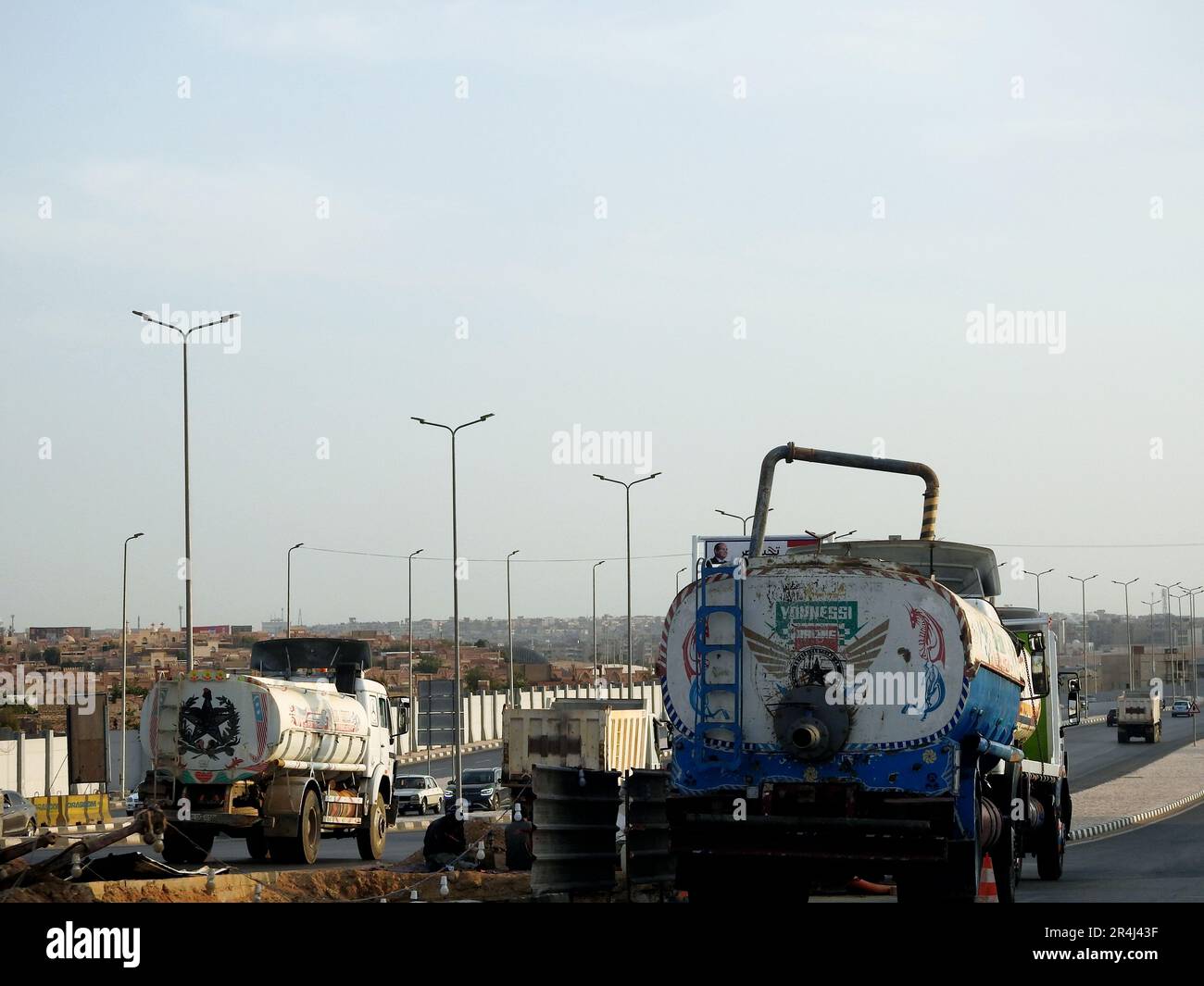 Cairo, Egypt, May 18 2023: preparations to place large water pipe parts ...