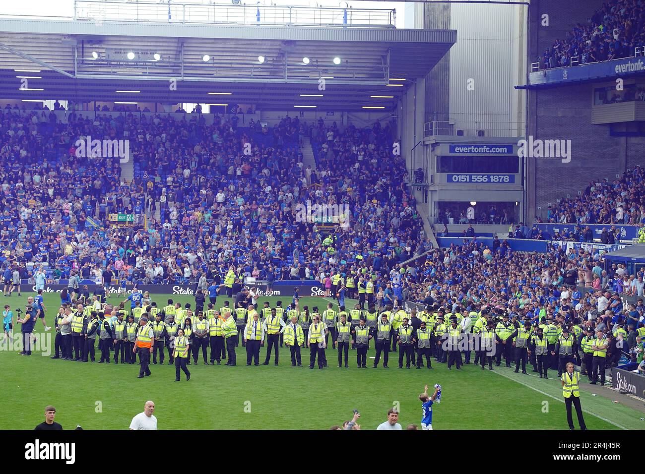 Everton fans invade the pitch after securing their safety by winning ...