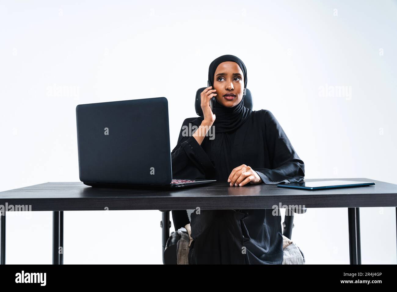 Beautiful arab middle-eastern corporate businesswoman with traditional ...