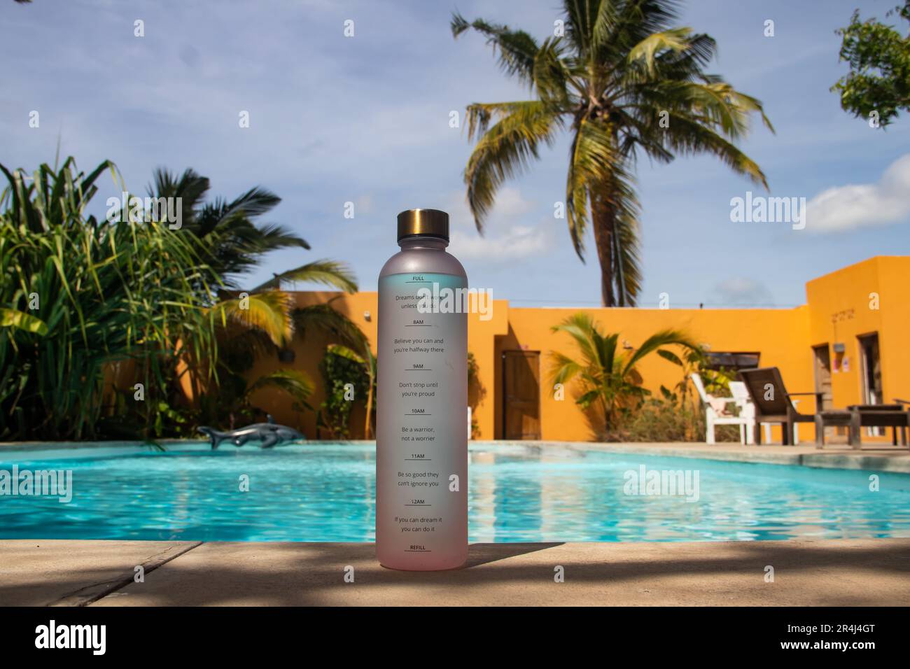 Graphic water bottle next to swimming pool, promoting healthy life by ...