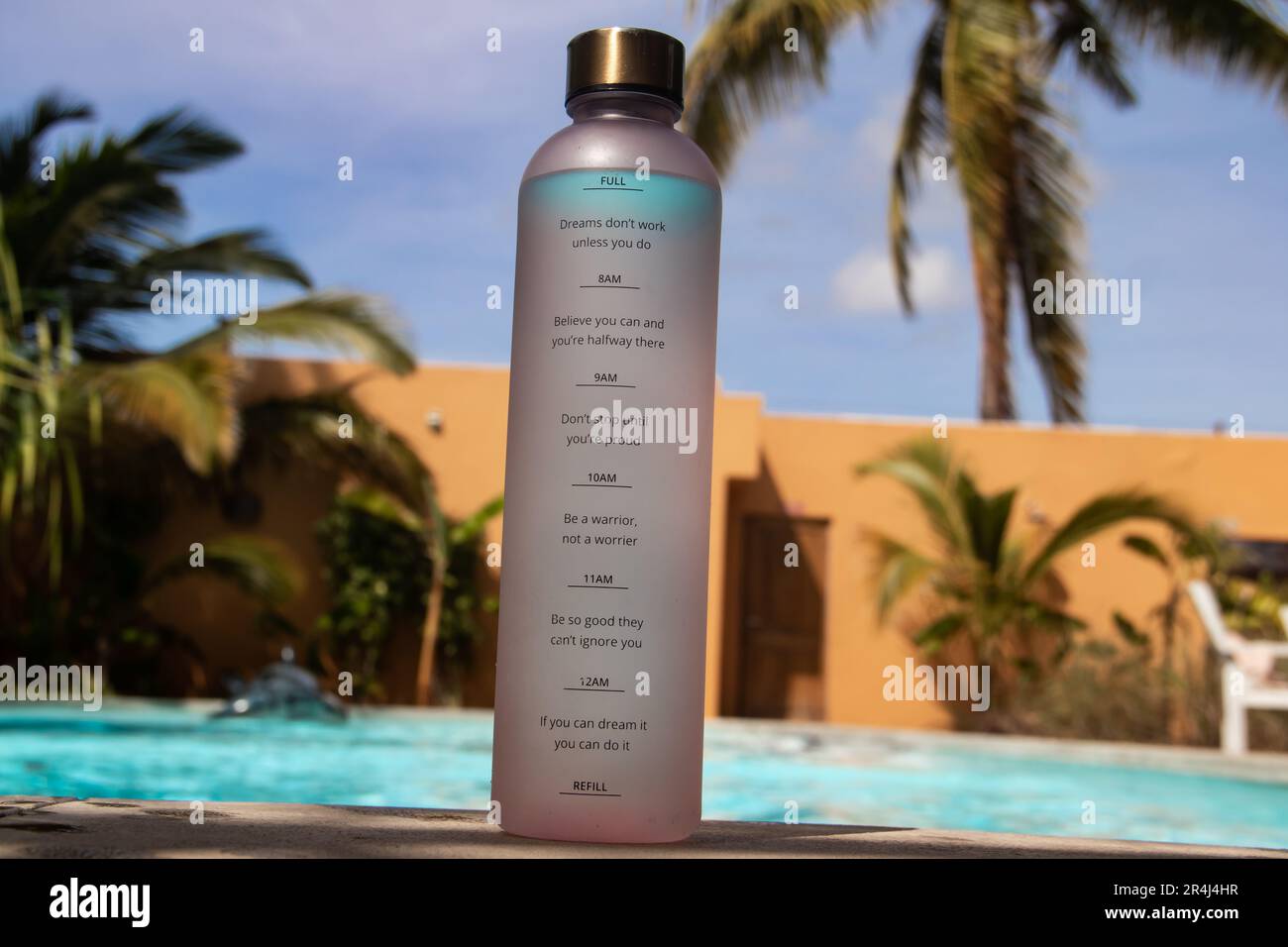 Graphic water bottle next to swimming pool, promoting healthy life by ...